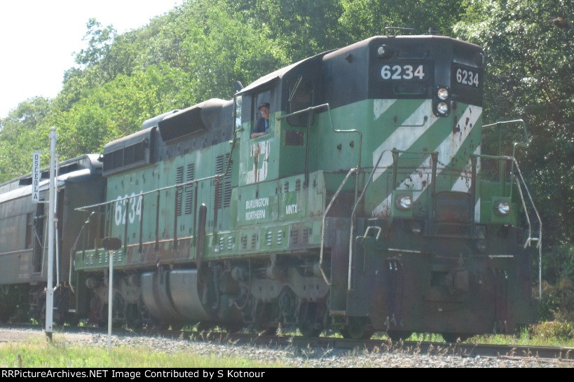 A former CB&Q SD9 on the MTM pulling passenger trains in Osceola MN in 2005.
